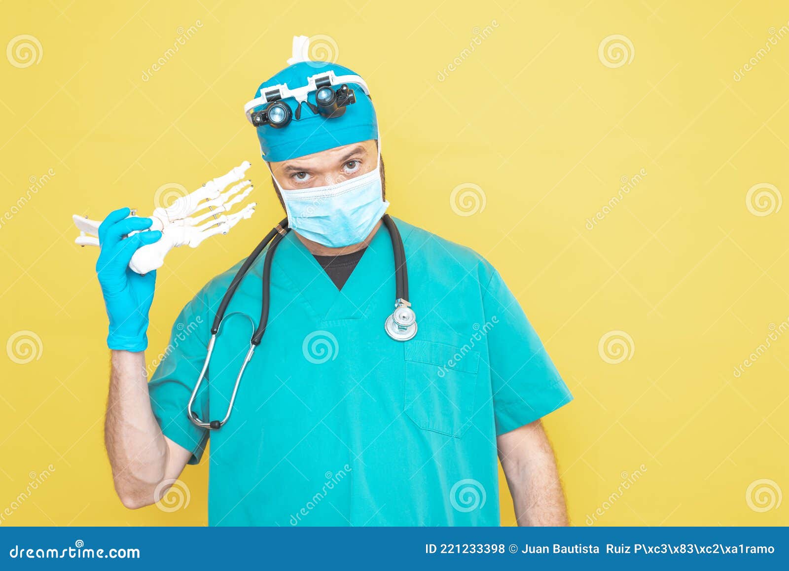 Young Doctor-surgeon Dressed in Green on Yellow Background Stock Photo ...