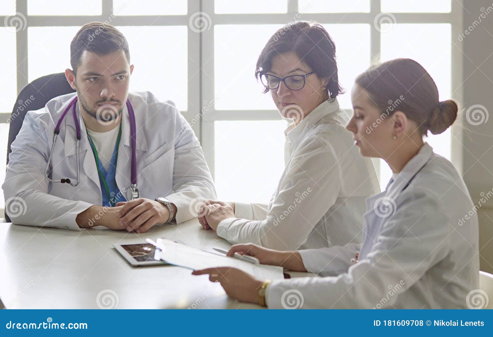 Young Doctor Talking To a Patient in the Office Stock Photo - Image of ...