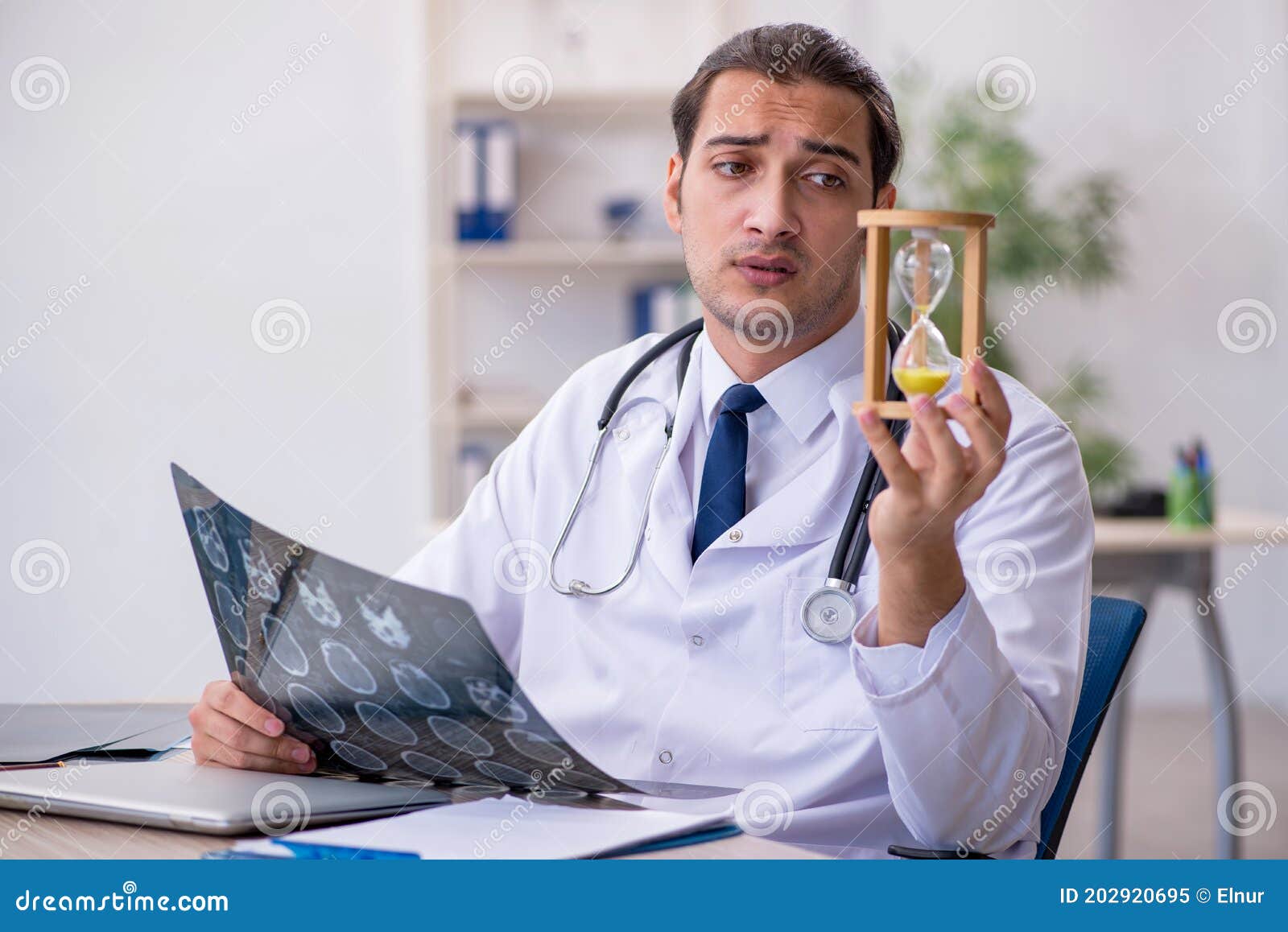 Young Male Doctor in Time Management Concept Stock Image - Image of ...