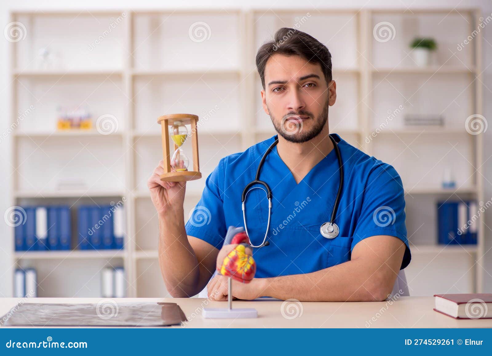 Young Male Doctor in Time Management Concept Stock Image - Image of ...