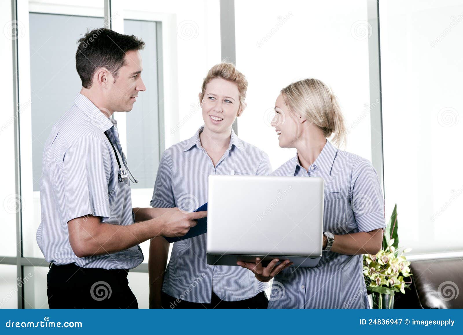 Young Doctor with Two Nurses Stock Image - Image of smiling, happy ...