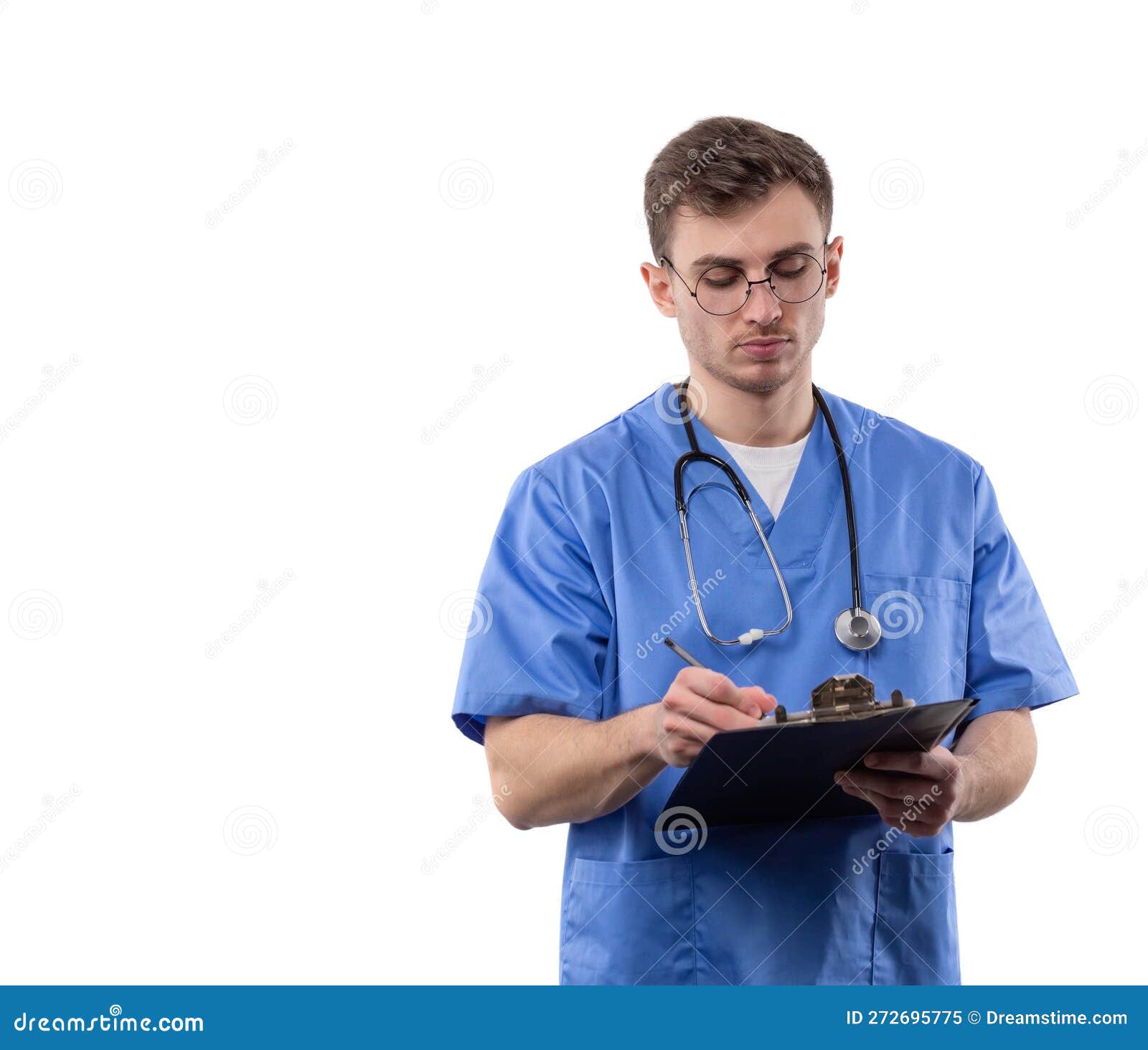Young Doctor in Uniform and with a Stethoscope Writes Annotations in a ...