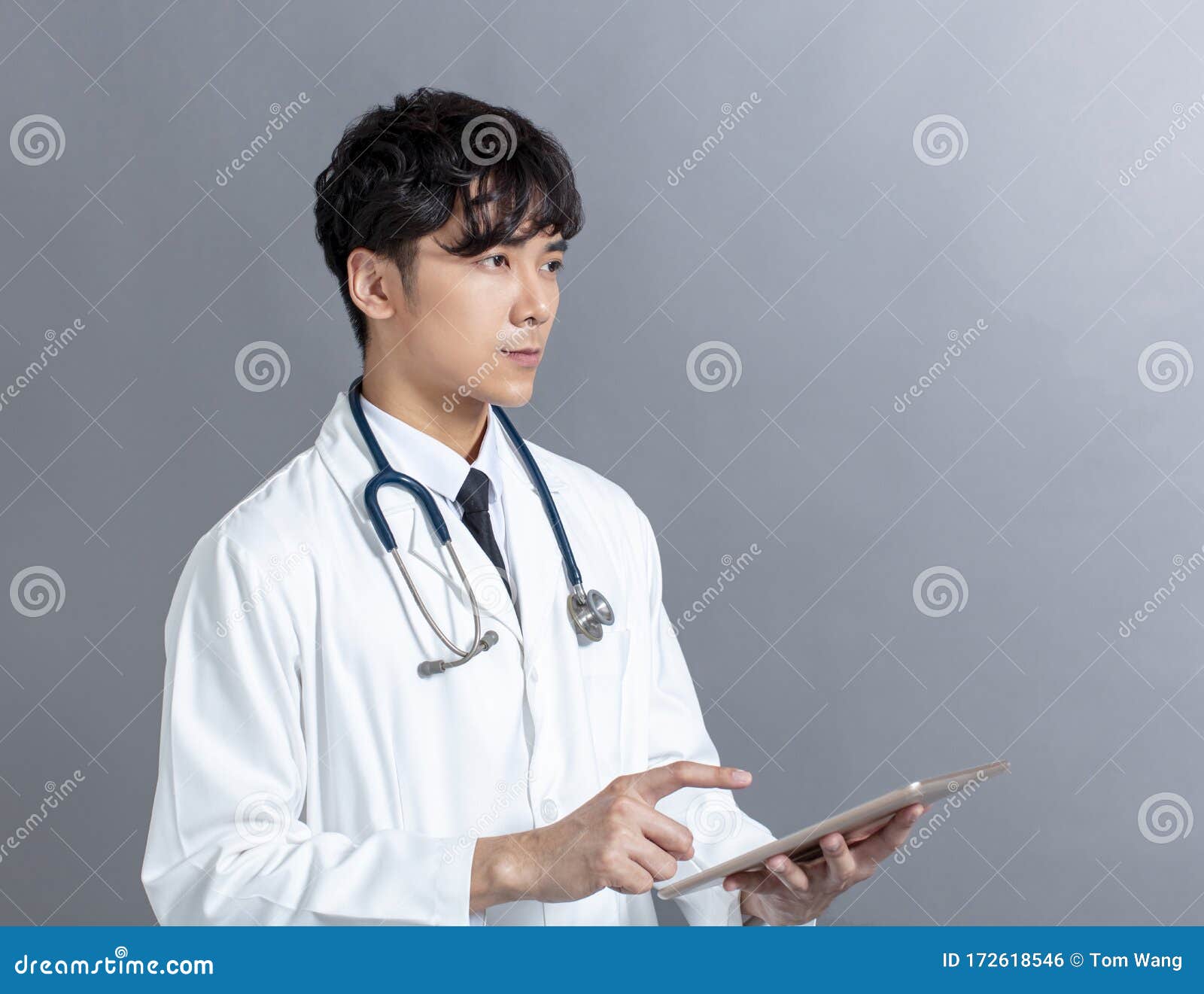Young Doctor Using Digital Tablet Stock Photo - Image of screen ...