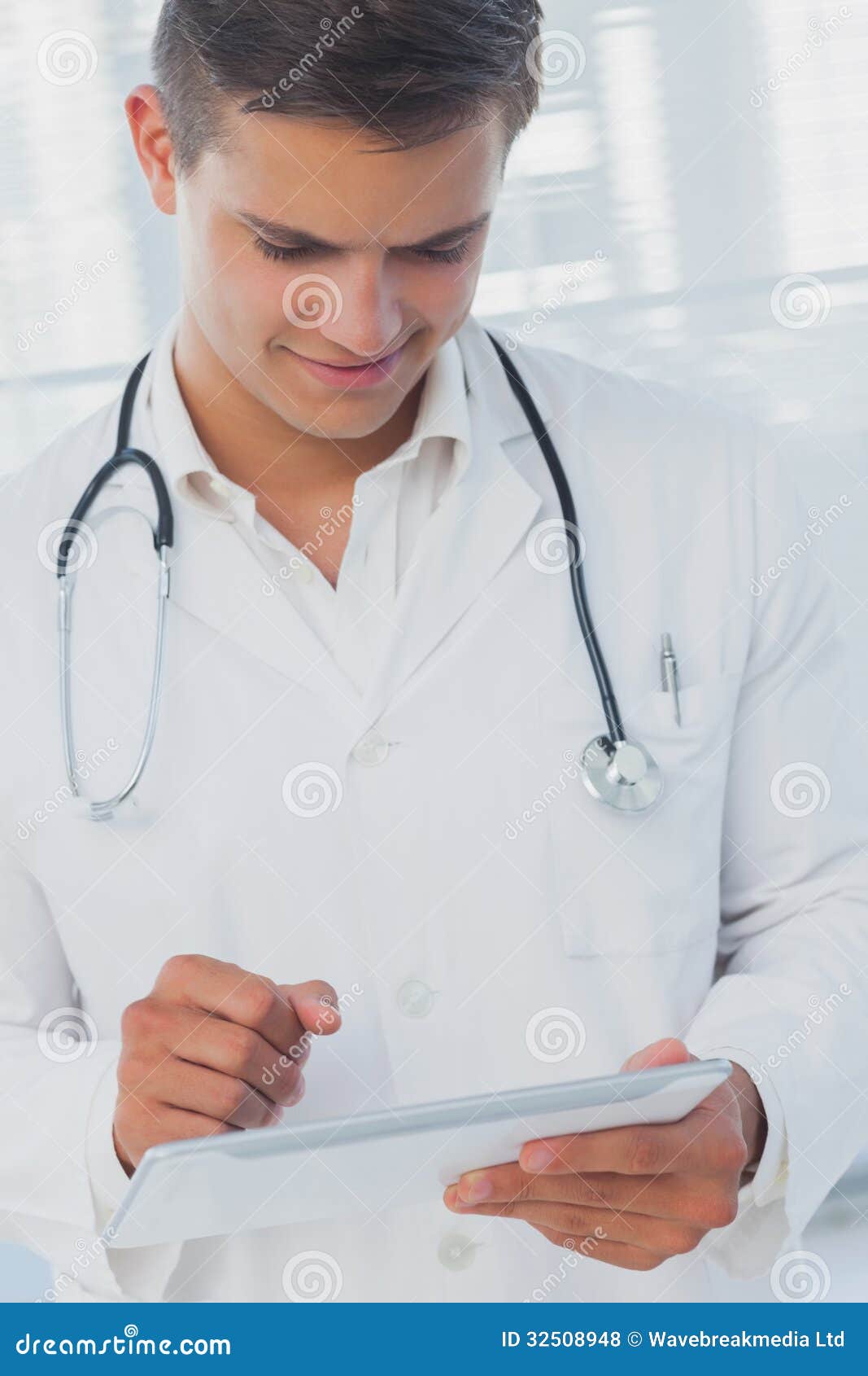Young doctor using tablet stock photo. Image of adult - 32508948