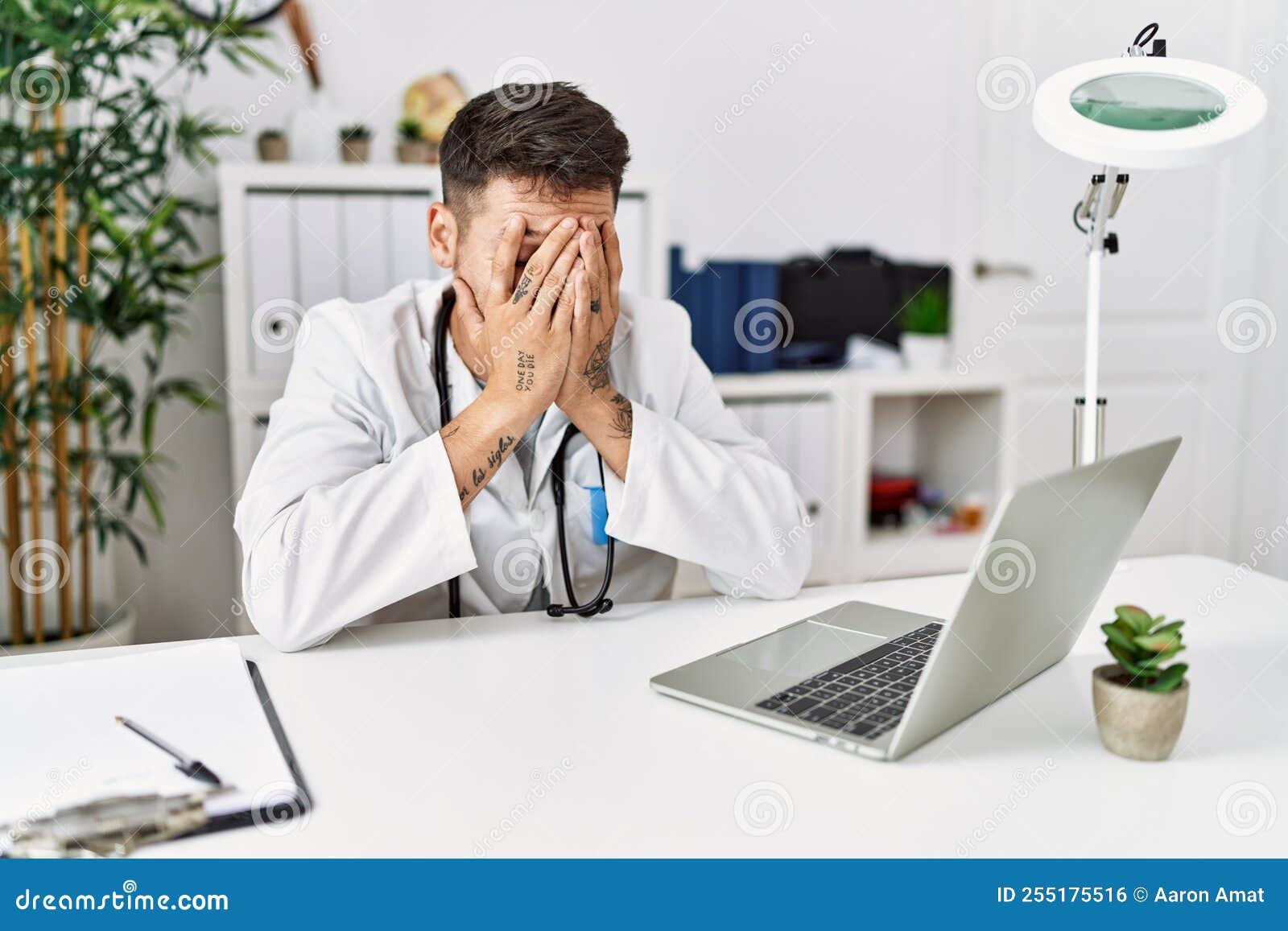 Young Doctor Working at the Clinic Using Computer Laptop with Sad ...