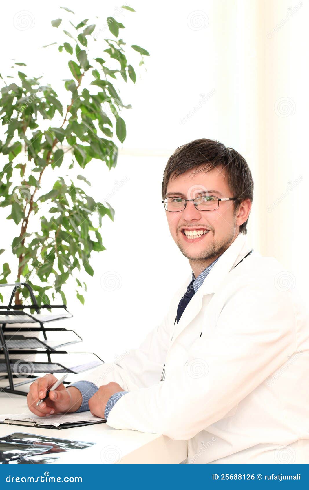Young Doctor Working in His Office Stock Photo - Image of nurse ...