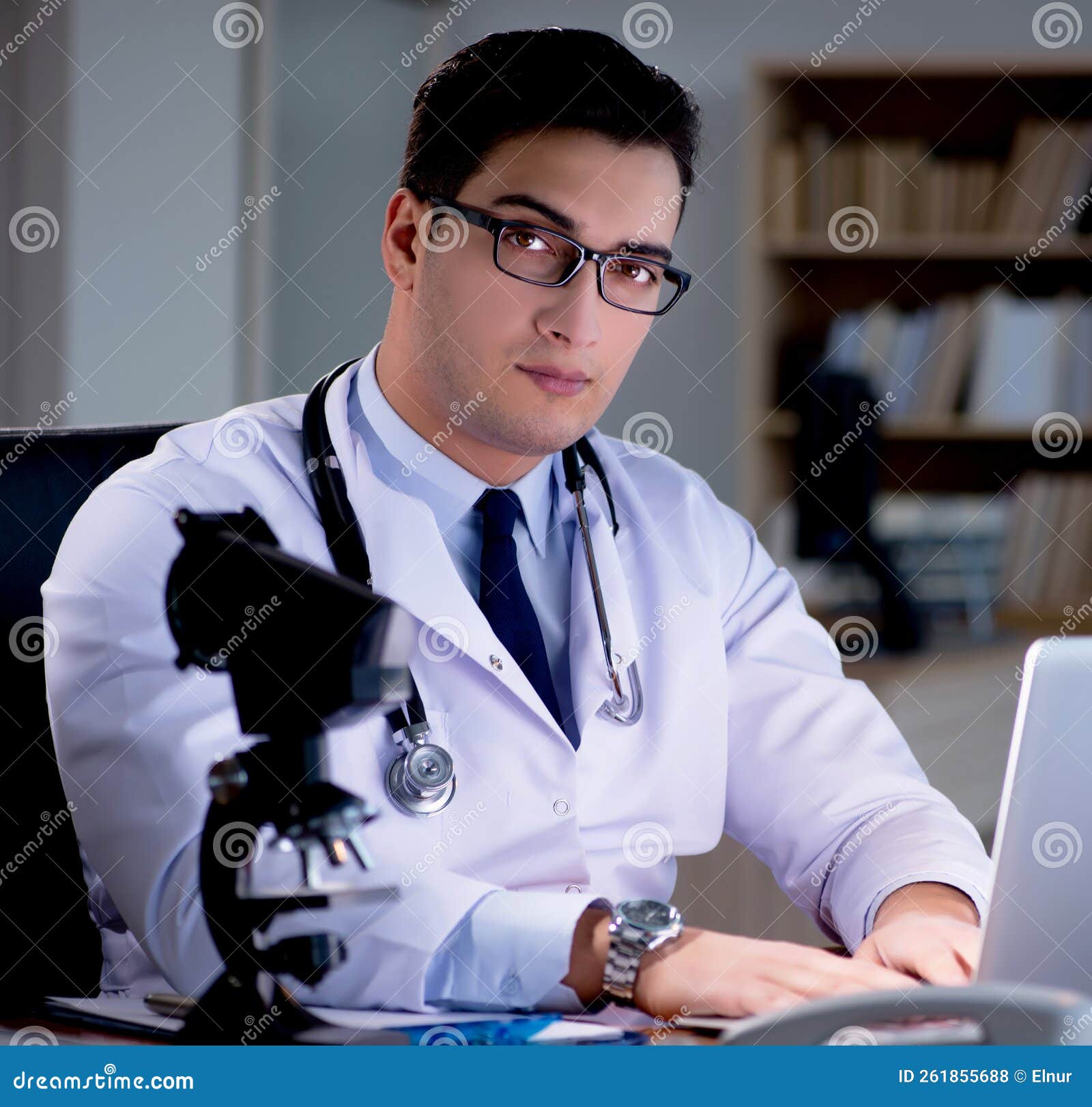 Young Doctor Working Late in the Office Stock Photo - Image of night ...