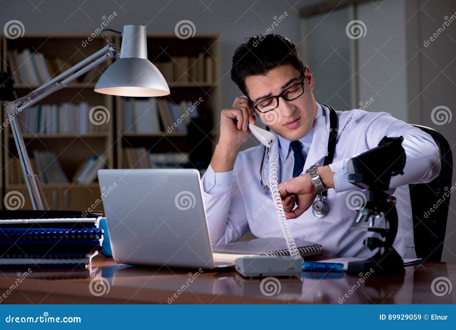 The Young Doctor Working Late in the Office Stock Image - Image of ...