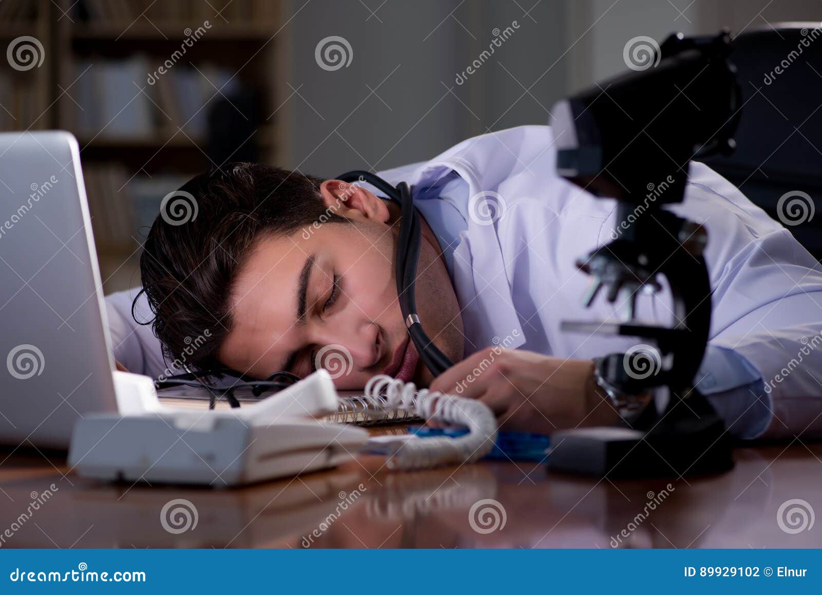 The Young Doctor Working Late in the Office Stock Photo - Image of ...
