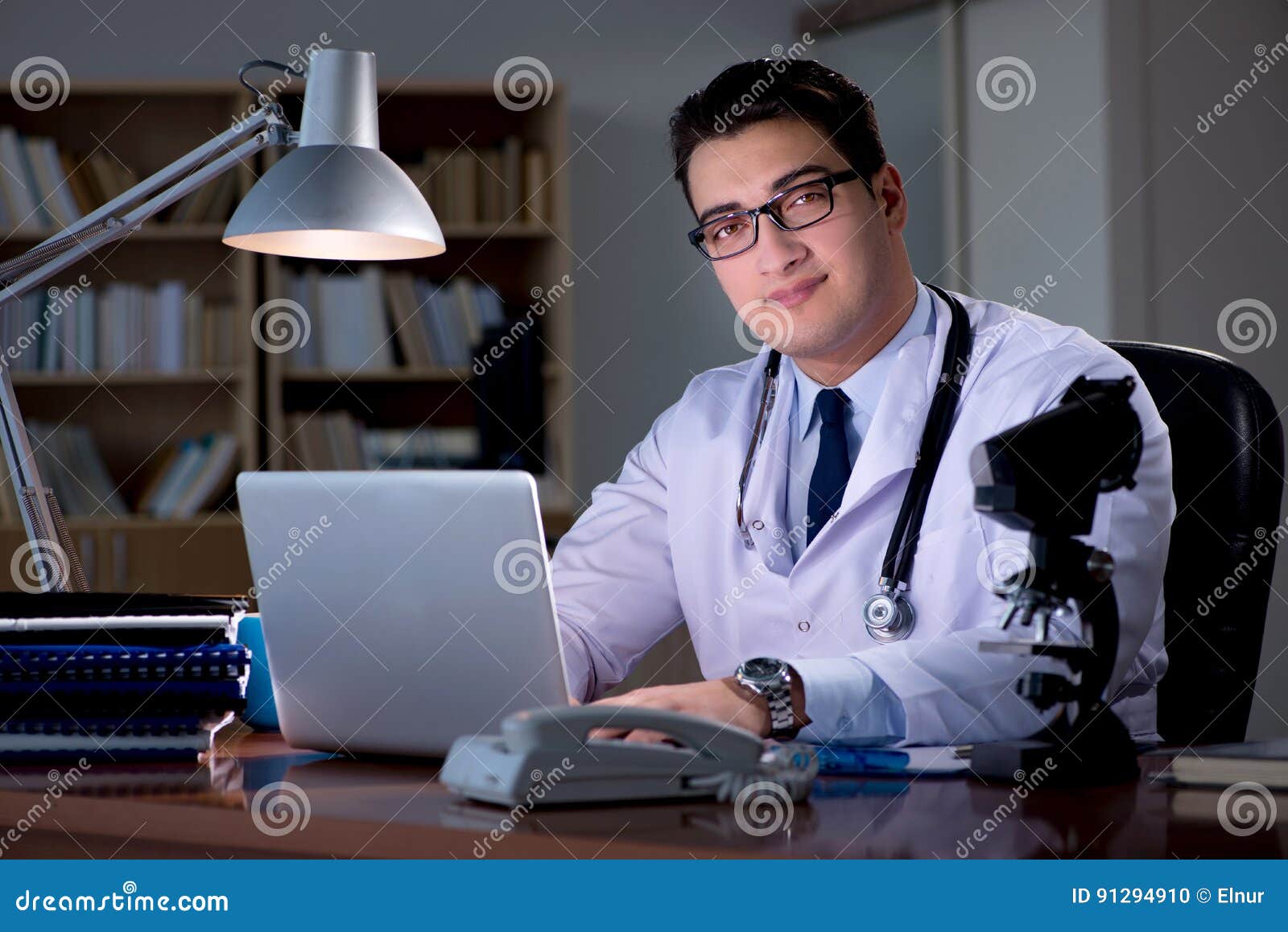 The Young Doctor Working Late in the Office Stock Photo - Image of ...