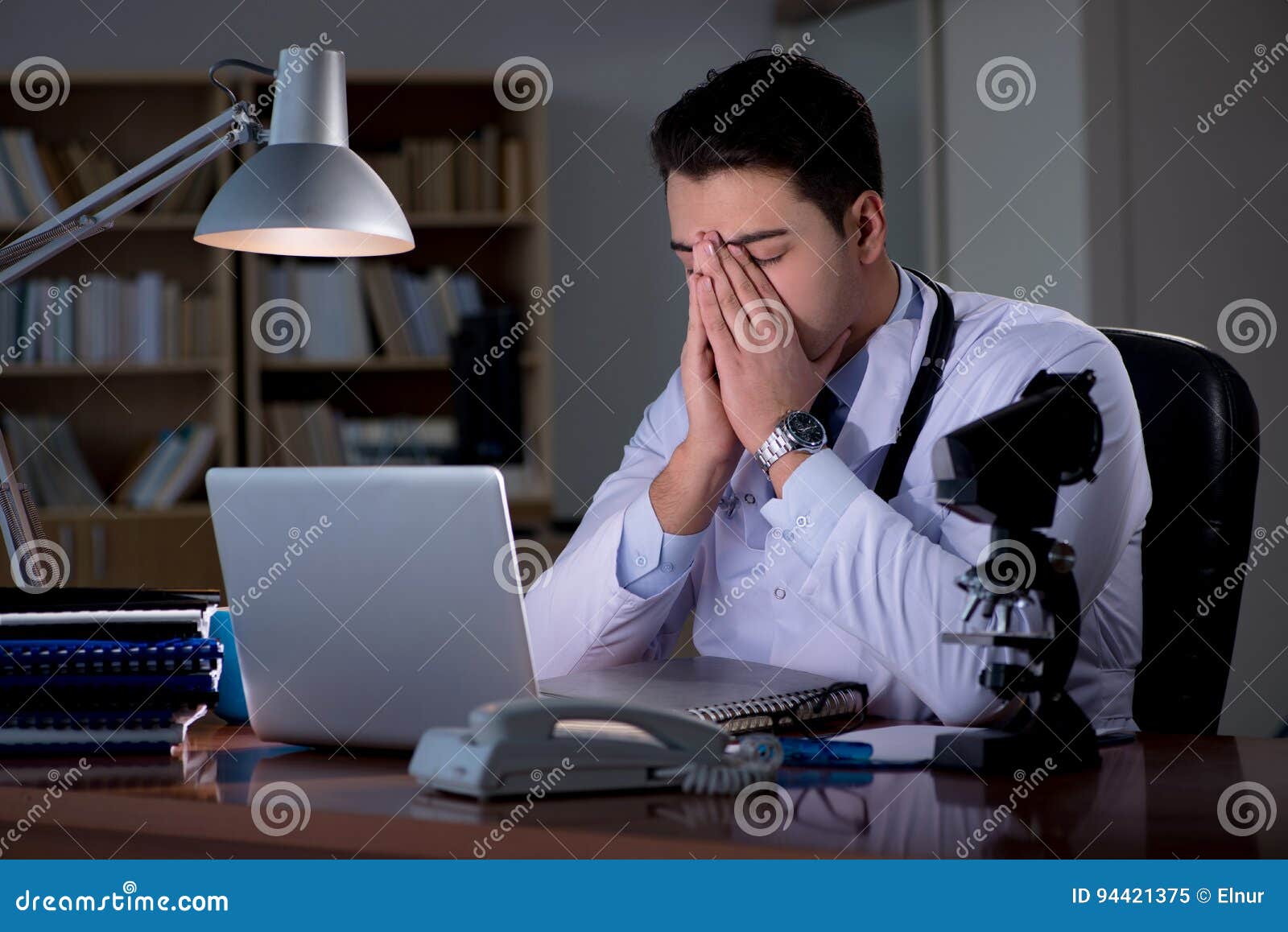 The Young Doctor Working Late in the Office Stock Image - Image of ...