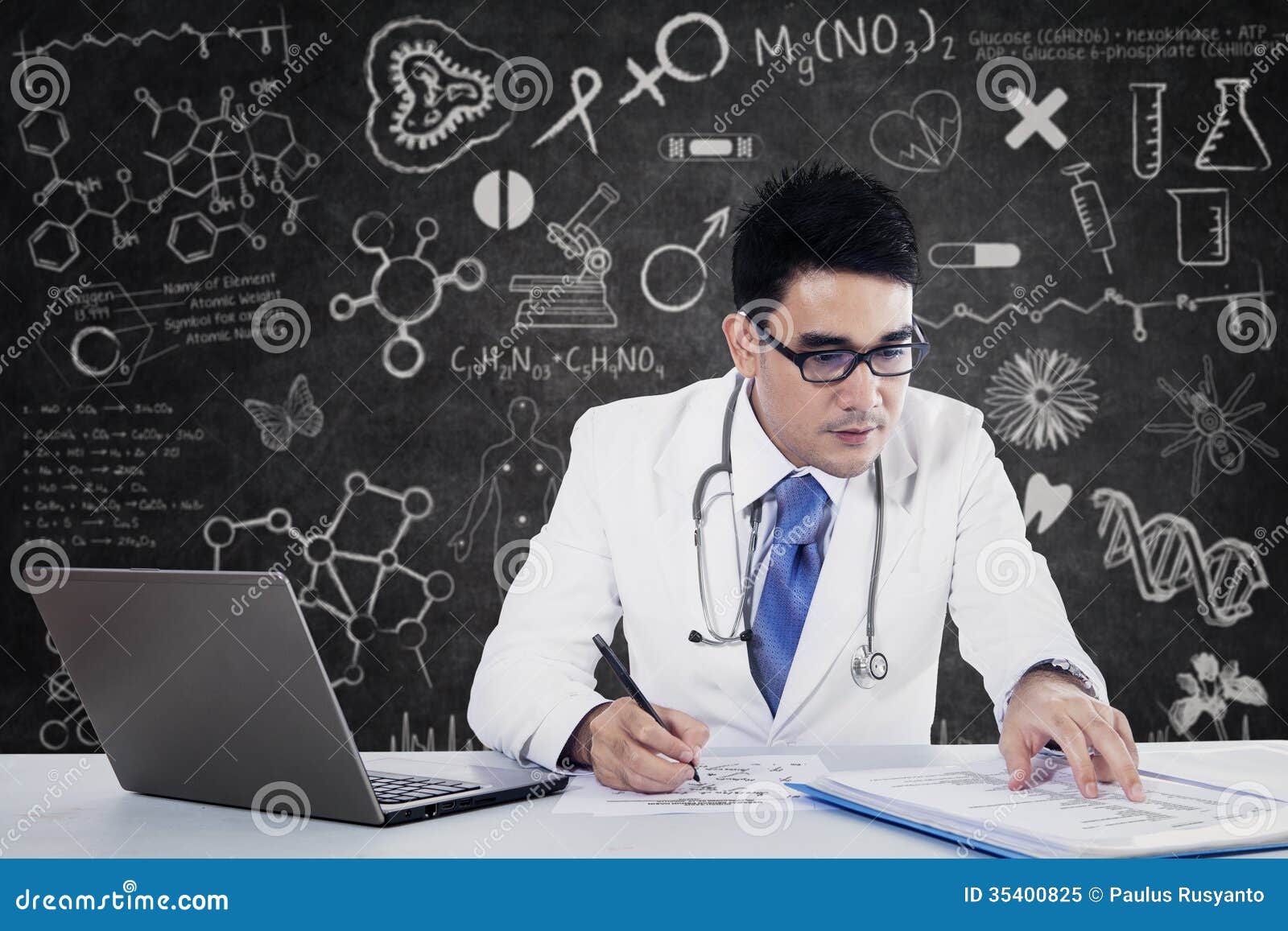 Young Doctor Working with Notebook Stock Image - Image of male ...