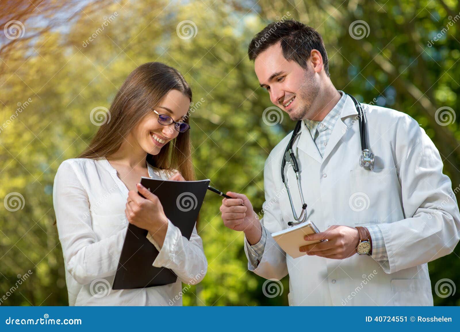 Young Doctor with Young and Pretty Assistant Stock Image - Image of ...