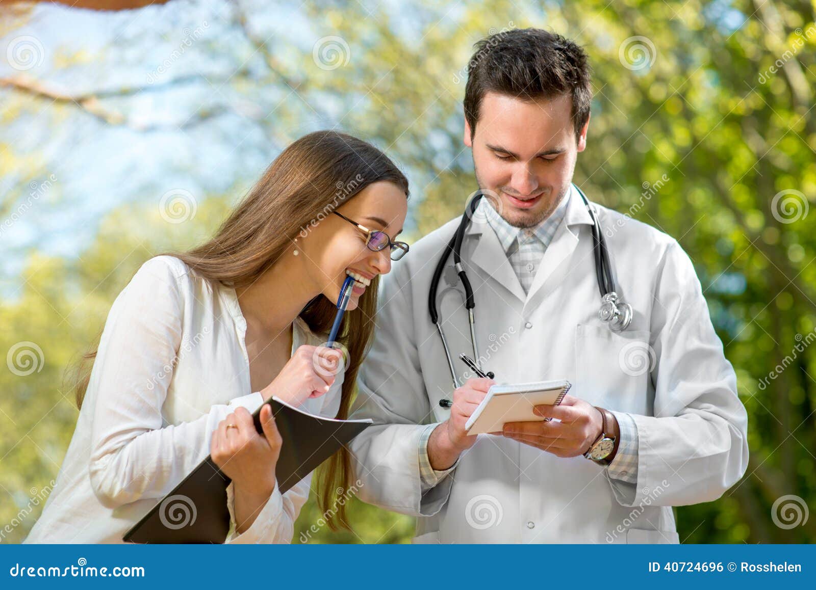 Young Doctor with Young and Pretty Assistant Stock Photo - Image of ...