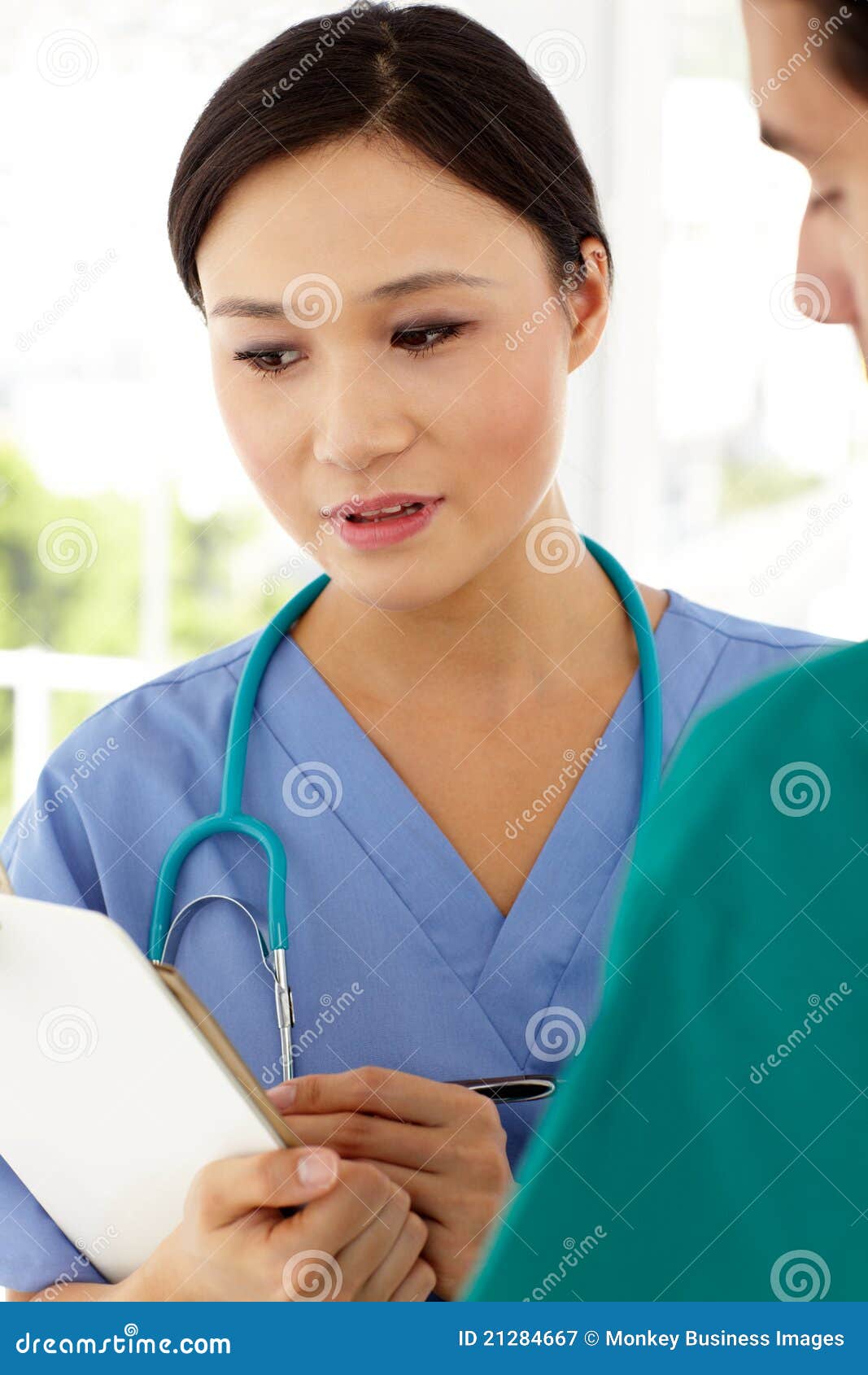 Young Doctors And Medical Students Train With Instruments And Plastic ...