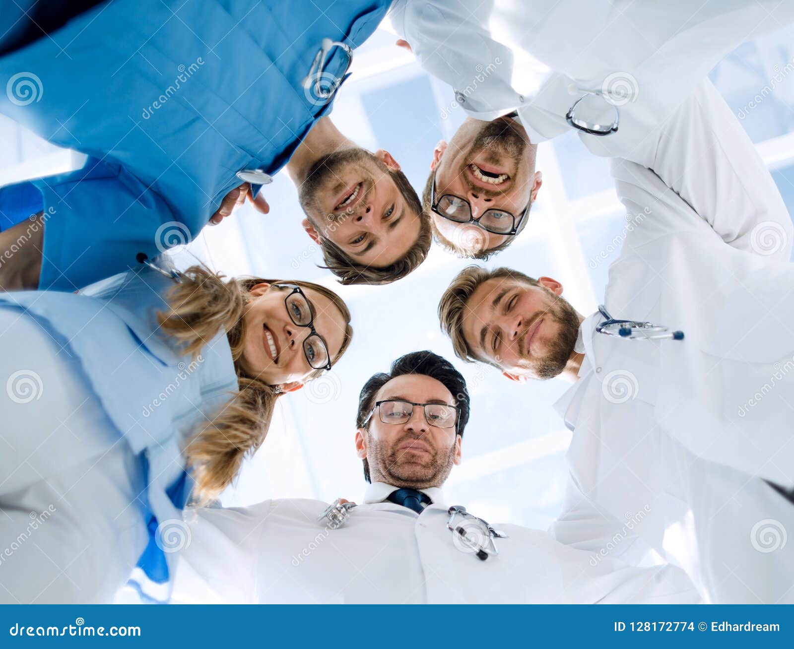 Doctors Looking Down Smiling at the Camera Stock Photo - Image of ...