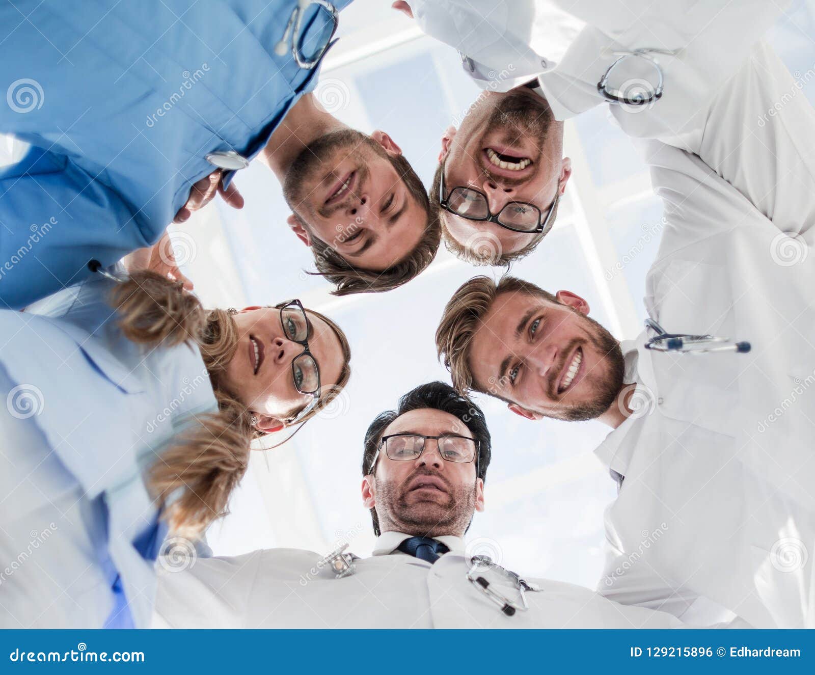 Doctors Looking Down Smiling at the Camera Stock Photo - Image of ...