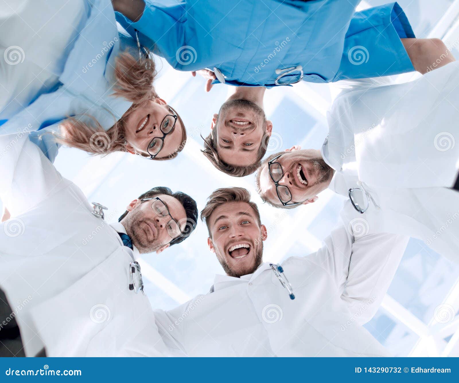 Doctors Looking Down Smiling at the Camera Stock Photo - Image of ...