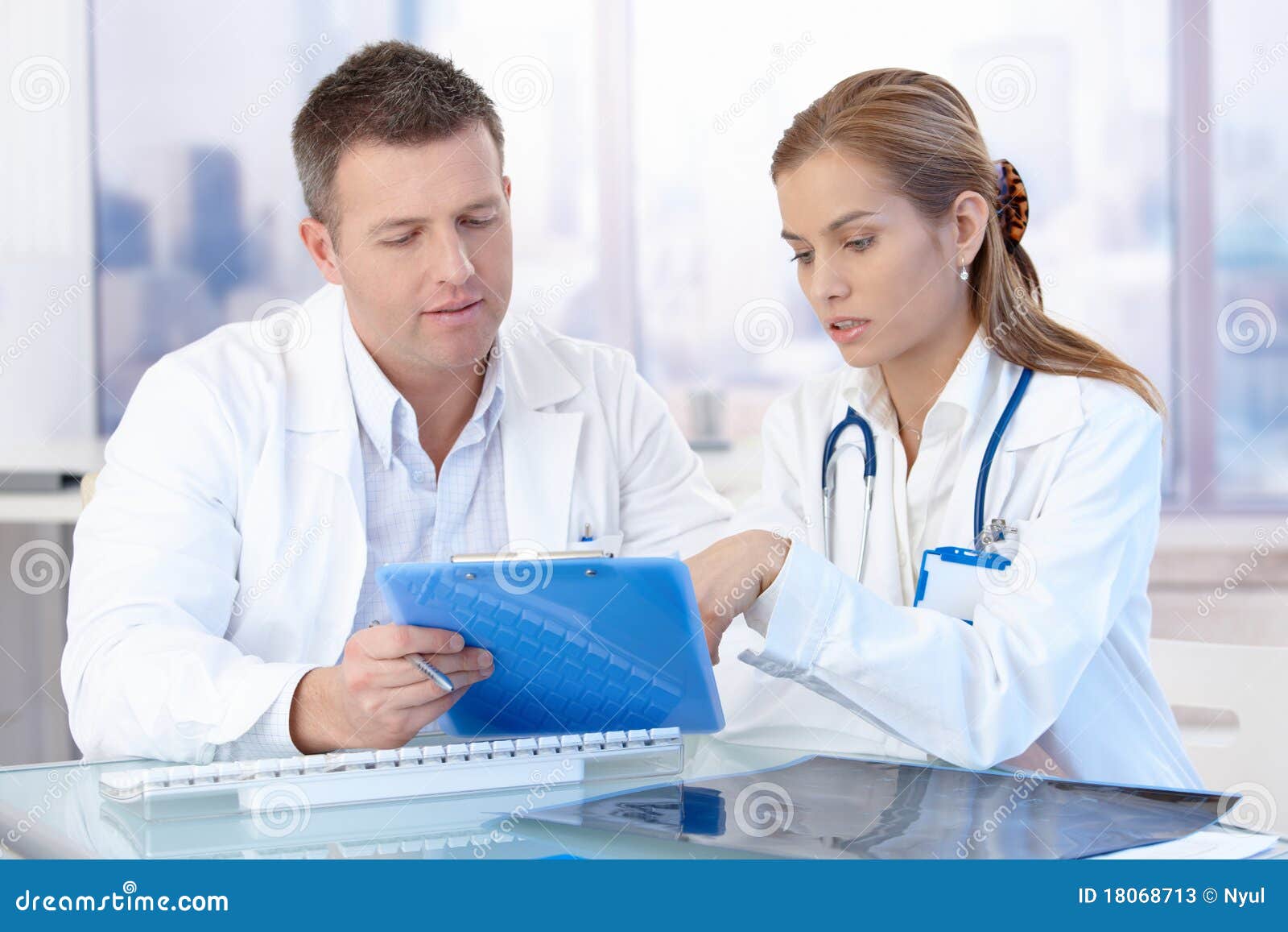 Young Doctors And Medical Students Train With Instruments And Plastic ...