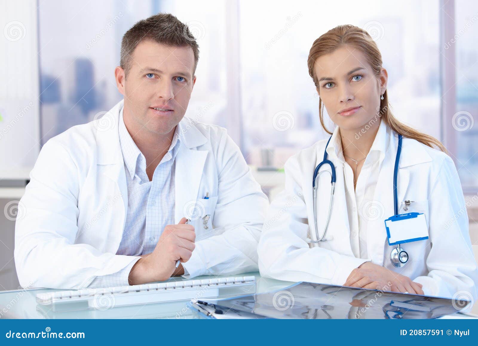 Young Doctors And Medical Students Train With Instruments And Plastic ...