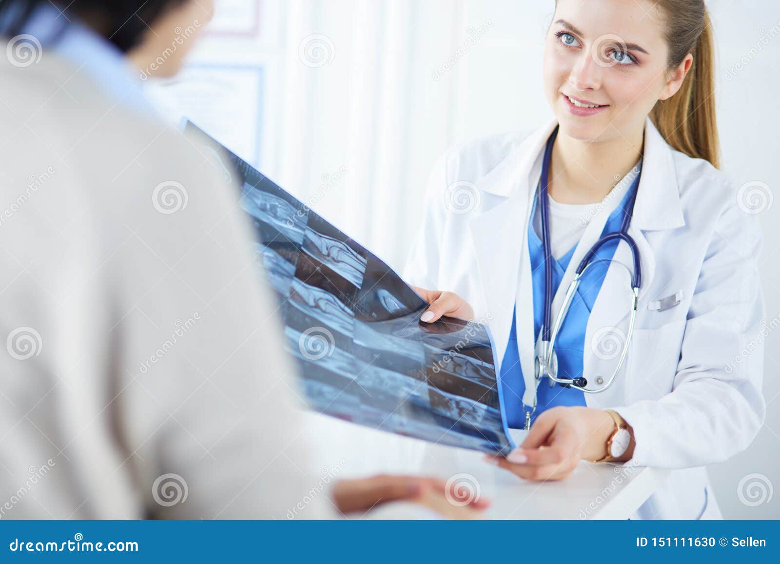 Young Doctors Studying X-ray Images in Clinic Stock Photo - Image of ...