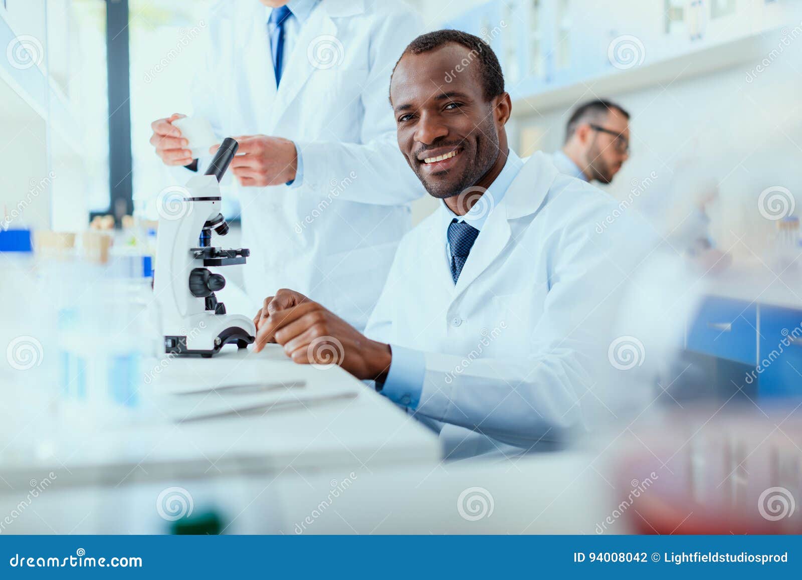 Young Doctors in Uniform Working at Testing Laboratory Stock Photo ...
