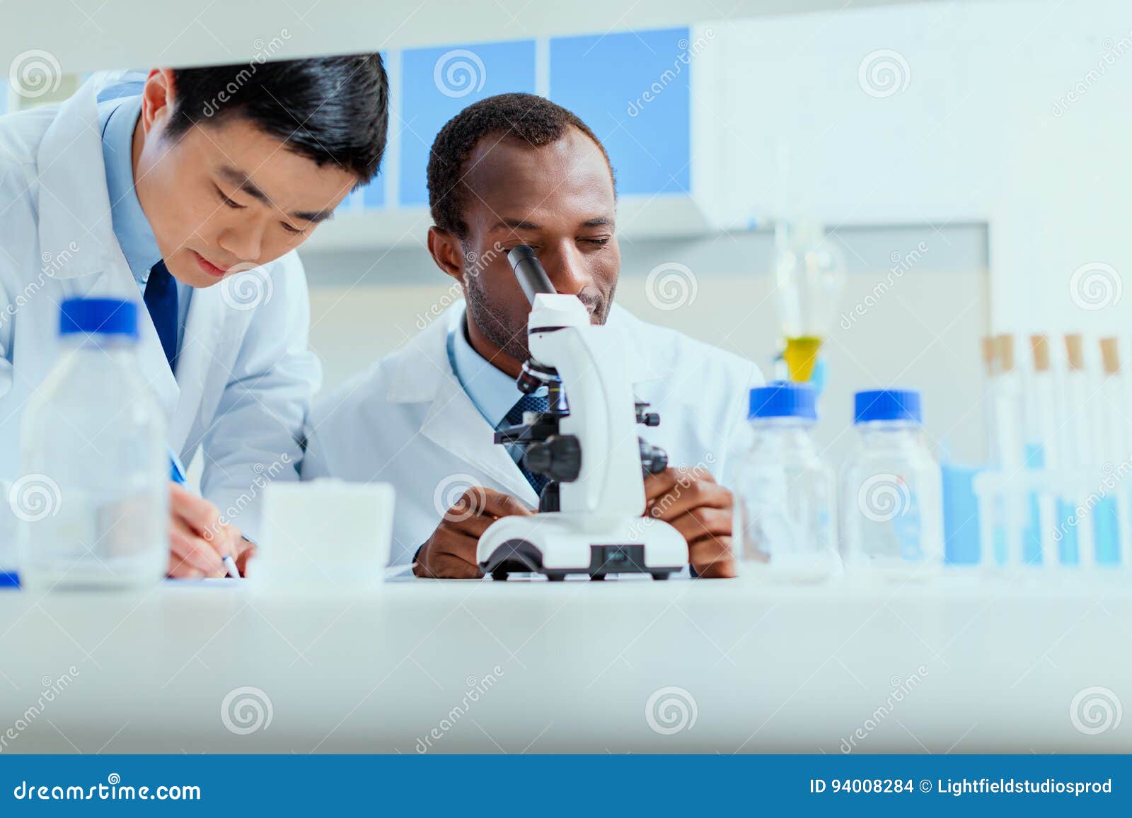 Young Doctors in Uniform Working at Testing Laboratory Stock Photo ...