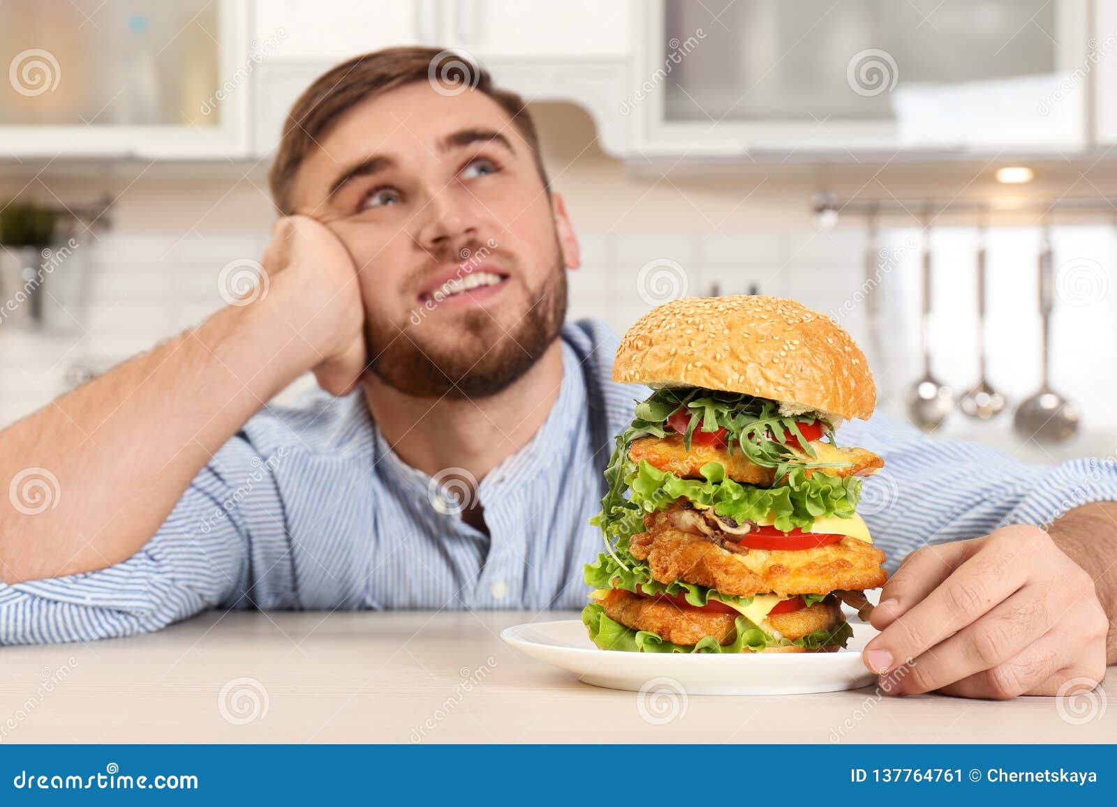 Young Dreamy Man Holding Plate with Huge Burger Stock Image - Image of ...