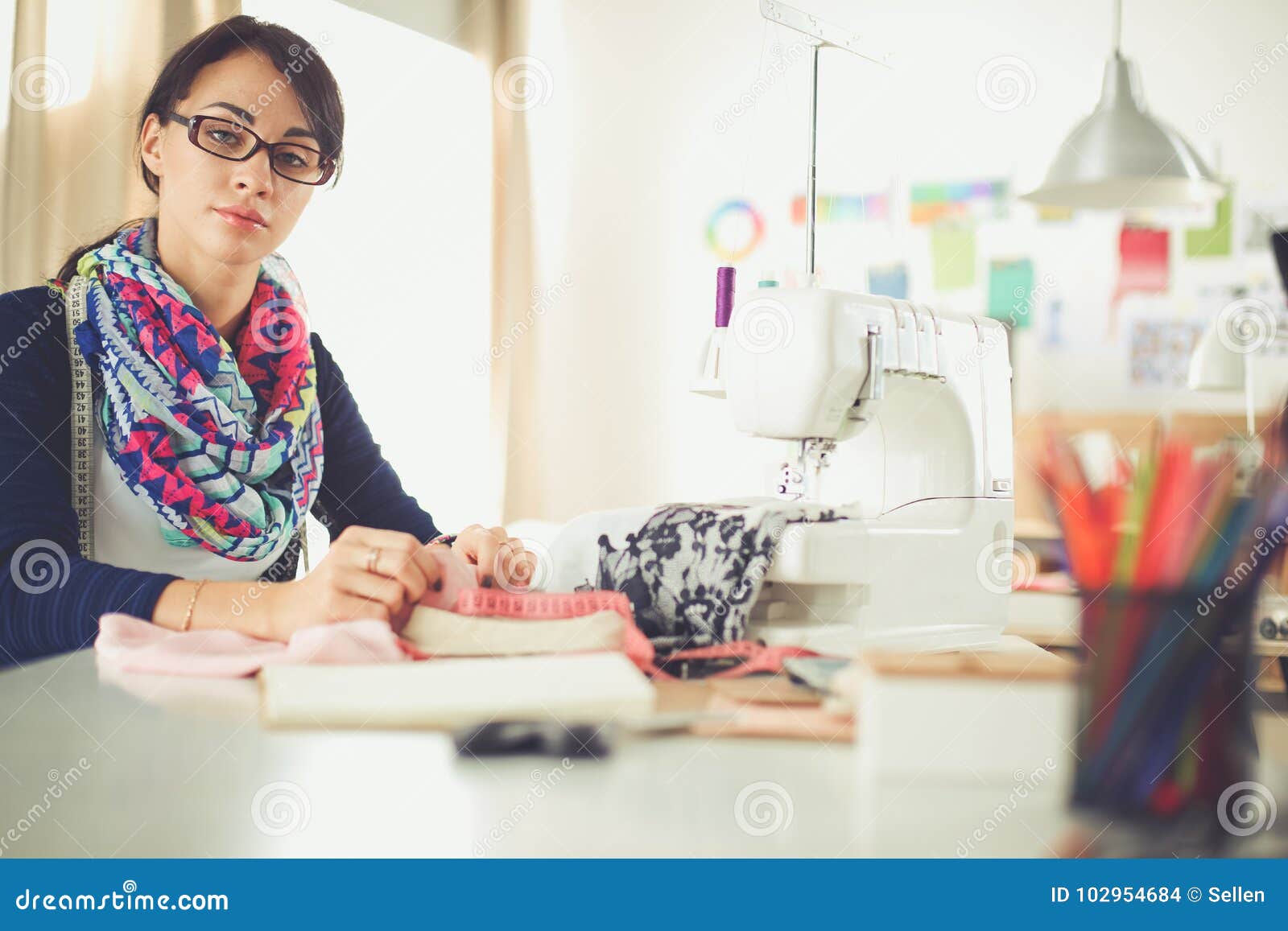 Young Dressmaker Designing Clothes Pattern on Paper . Stock Photo ...