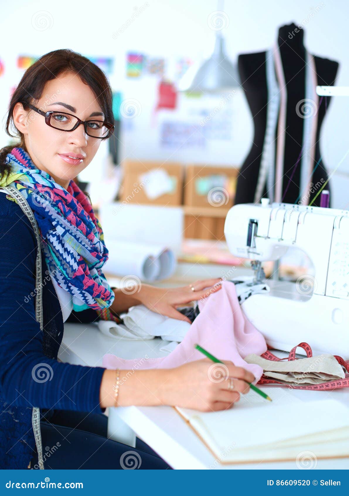Young Dressmaker Designing Clothes Pattern on Paper Stock Photo - Image ...
