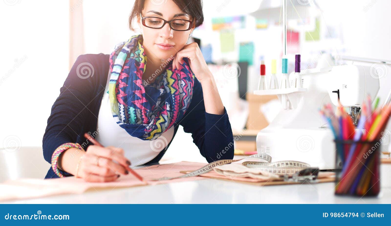 Young Dressmaker Designing Clothes Pattern on Paper Stock Photo - Image ...