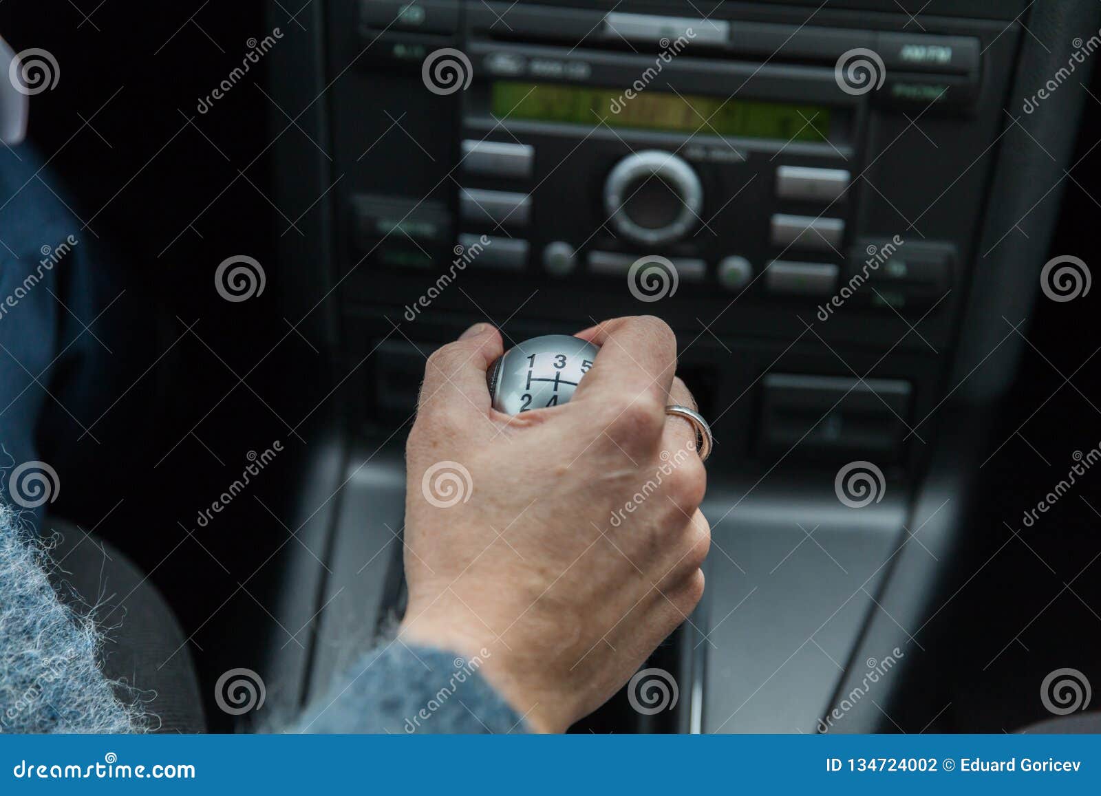 A Driver in a Car Performs Tasks Necessary To Steer the Vehicle Stock ...