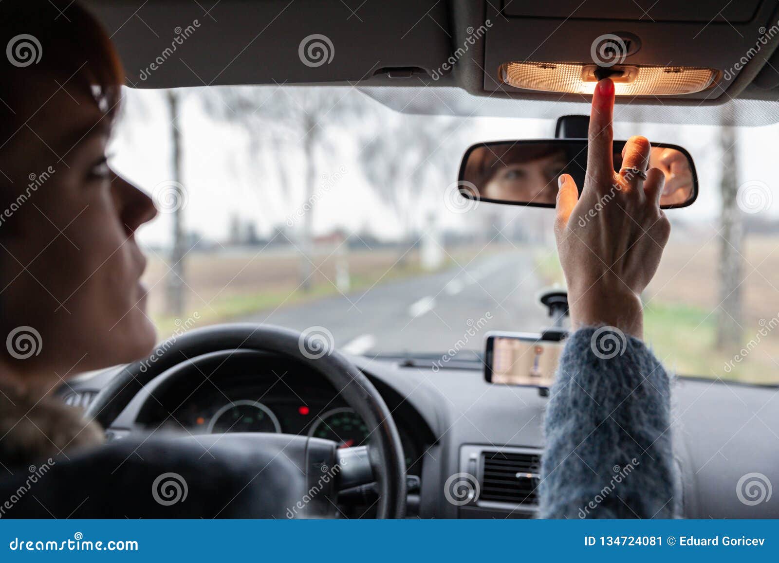 A Driver in a Car Performs Tasks Necessary To Steer the Vehicle Stock ...