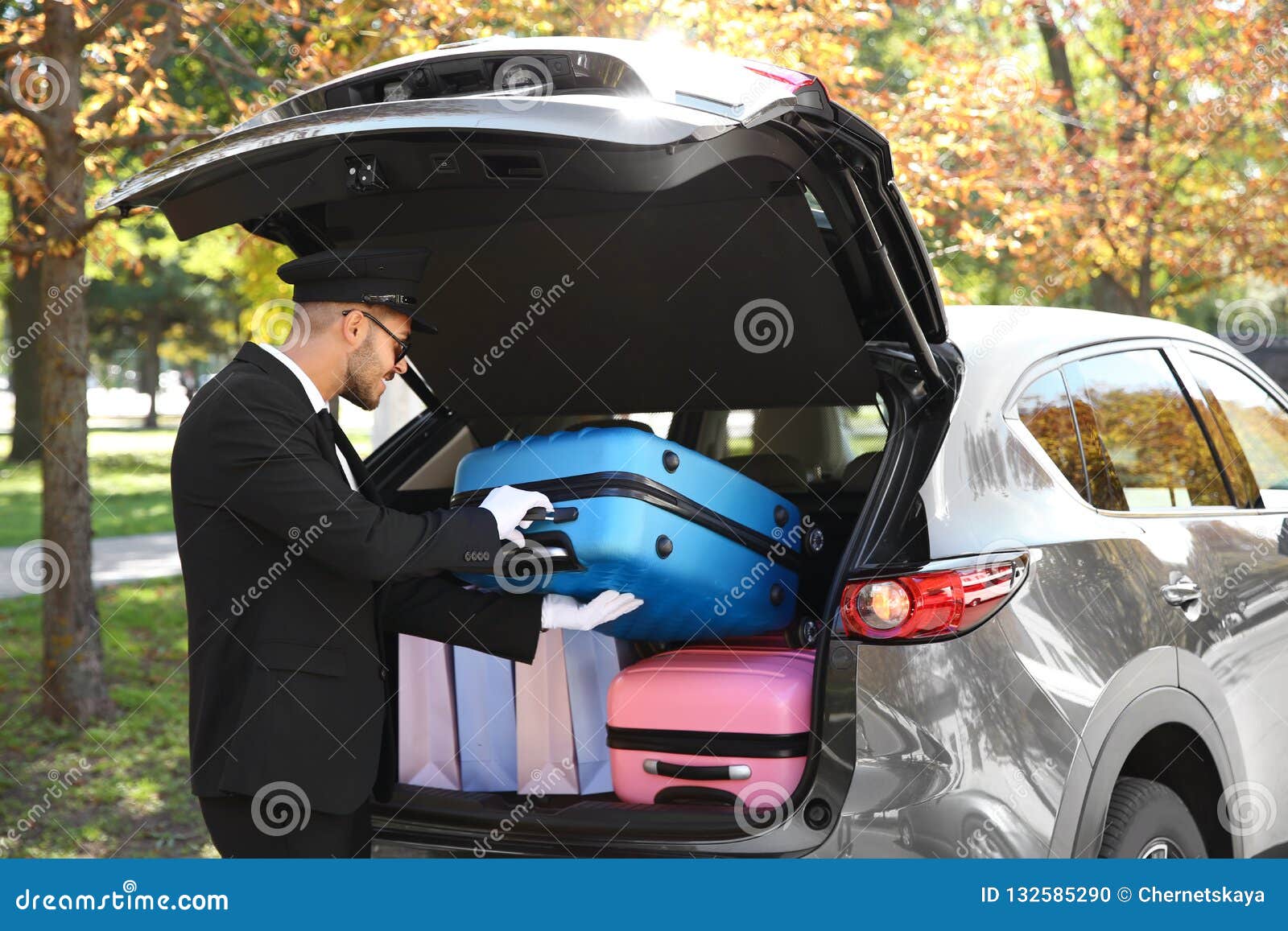 Young Driver Loading Suitcases into Car Trunk Stock Photo - Image of ...