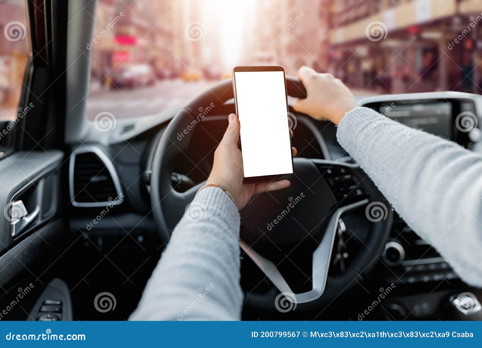 Young Driver Using Smartphon in the Car while Driving or Parking ...