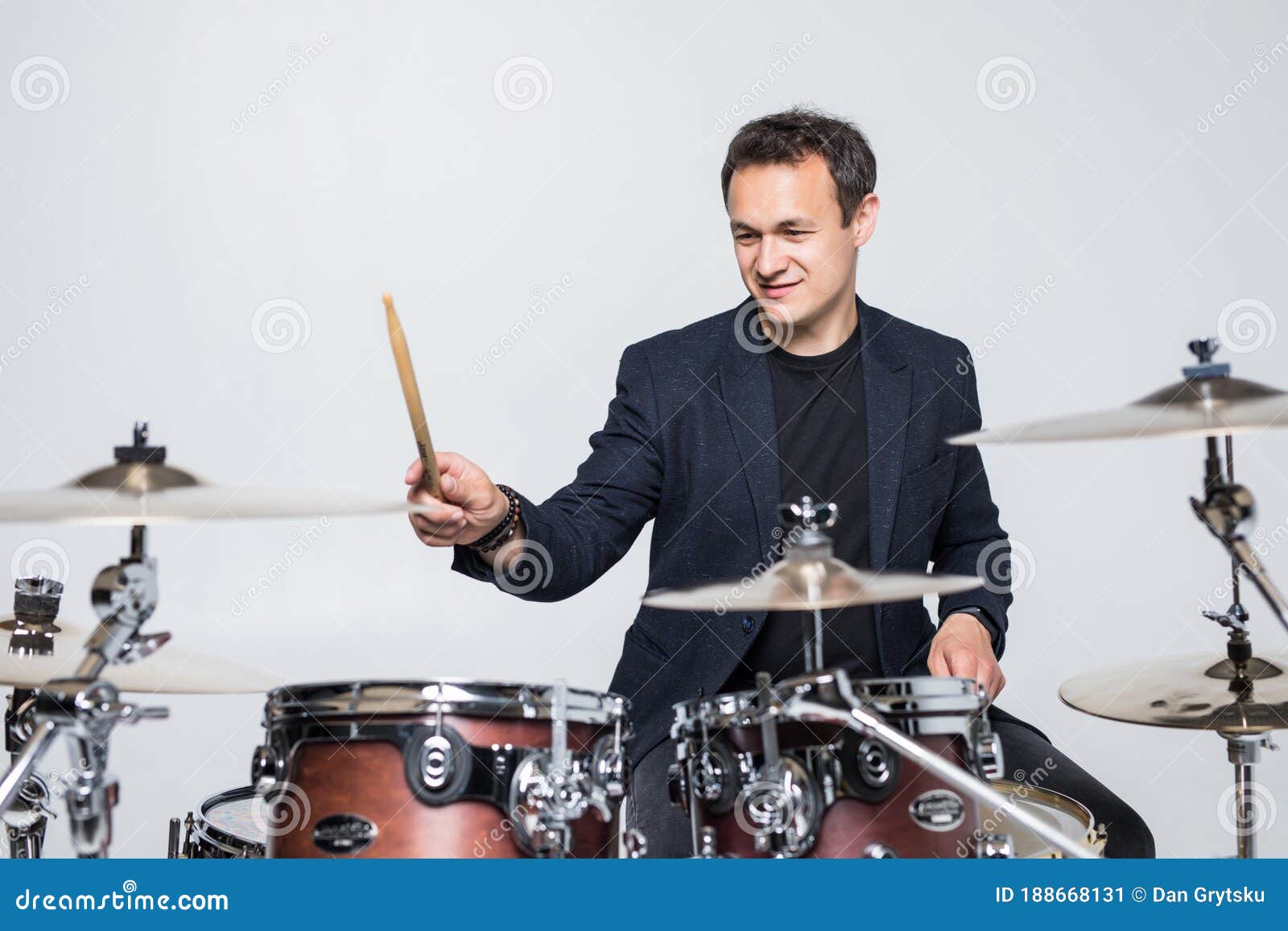 Young Drummer Behind Drum Set and Plays the Drums Isolated on White ...