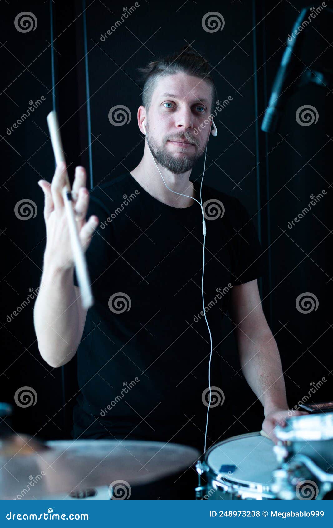 A Young Drummer in a Recording Studio Plays Drums Sounded by ...