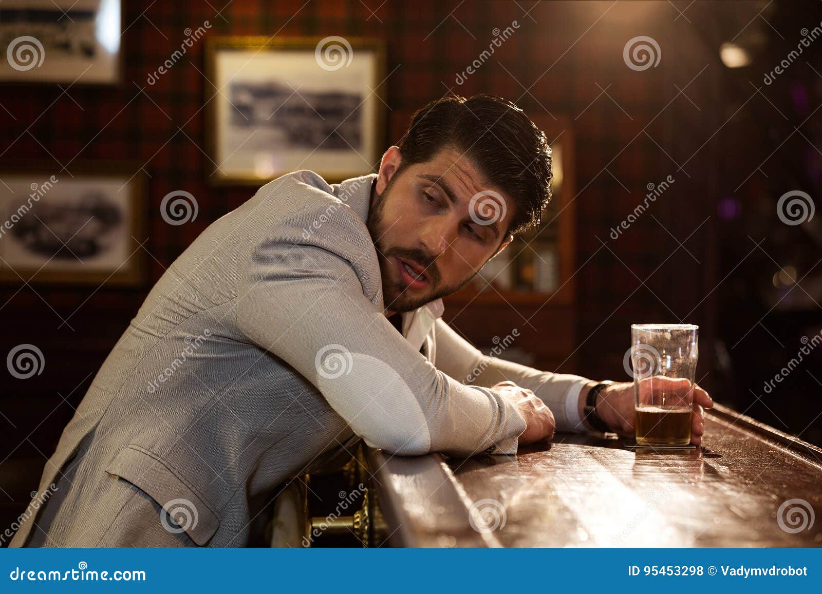 Young Drunk Man Sitting at the Counter in a Pub Stock Photo - Image of ...