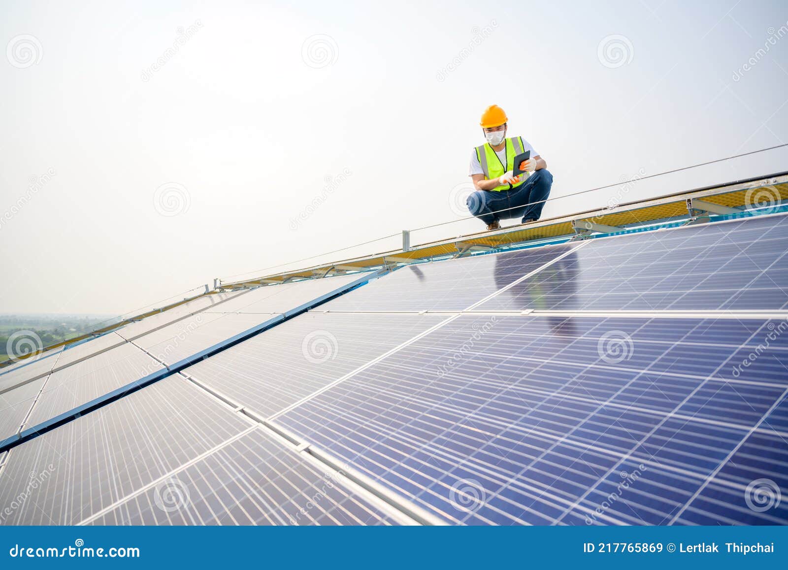 Young Electrical Engineer Work in a Photovoltaic Power Plant Checking ...
