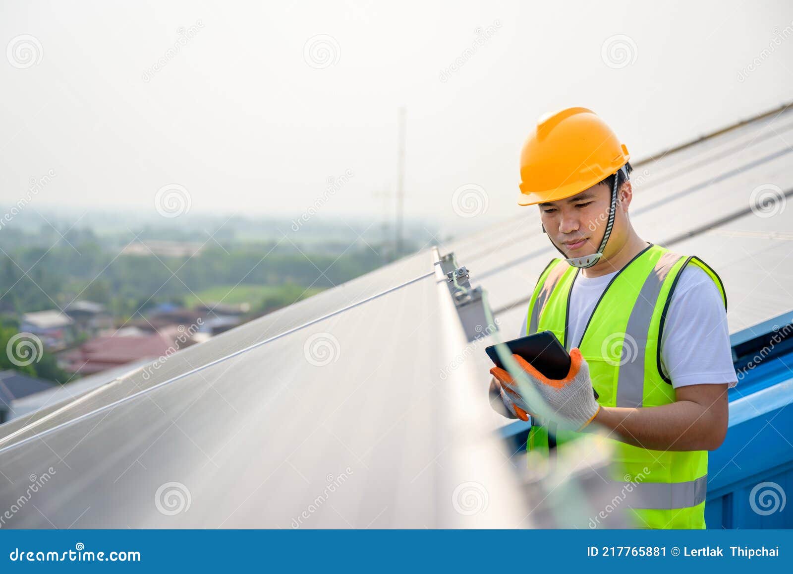Young Electrical Engineer Work in a Photovoltaic Power Plant Checking ...