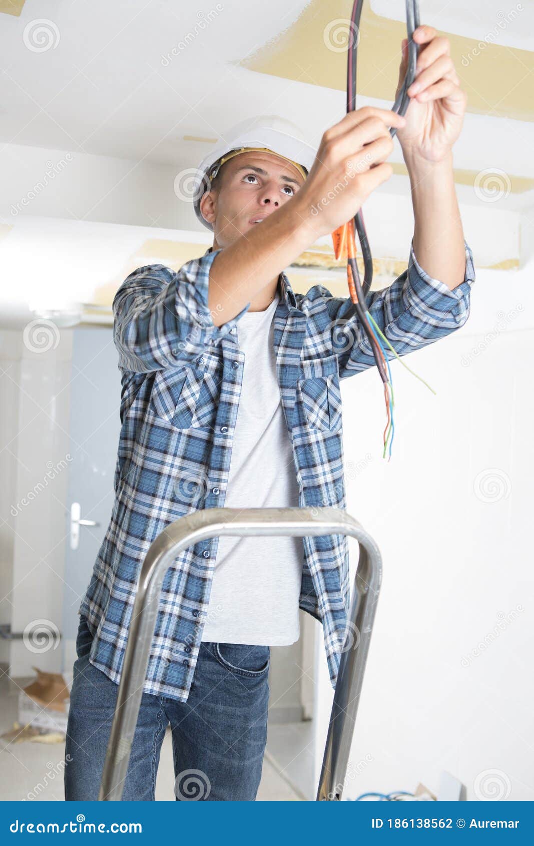 Young Electrician Fixing Cables on Ceiling Stock Photo - Image of ...