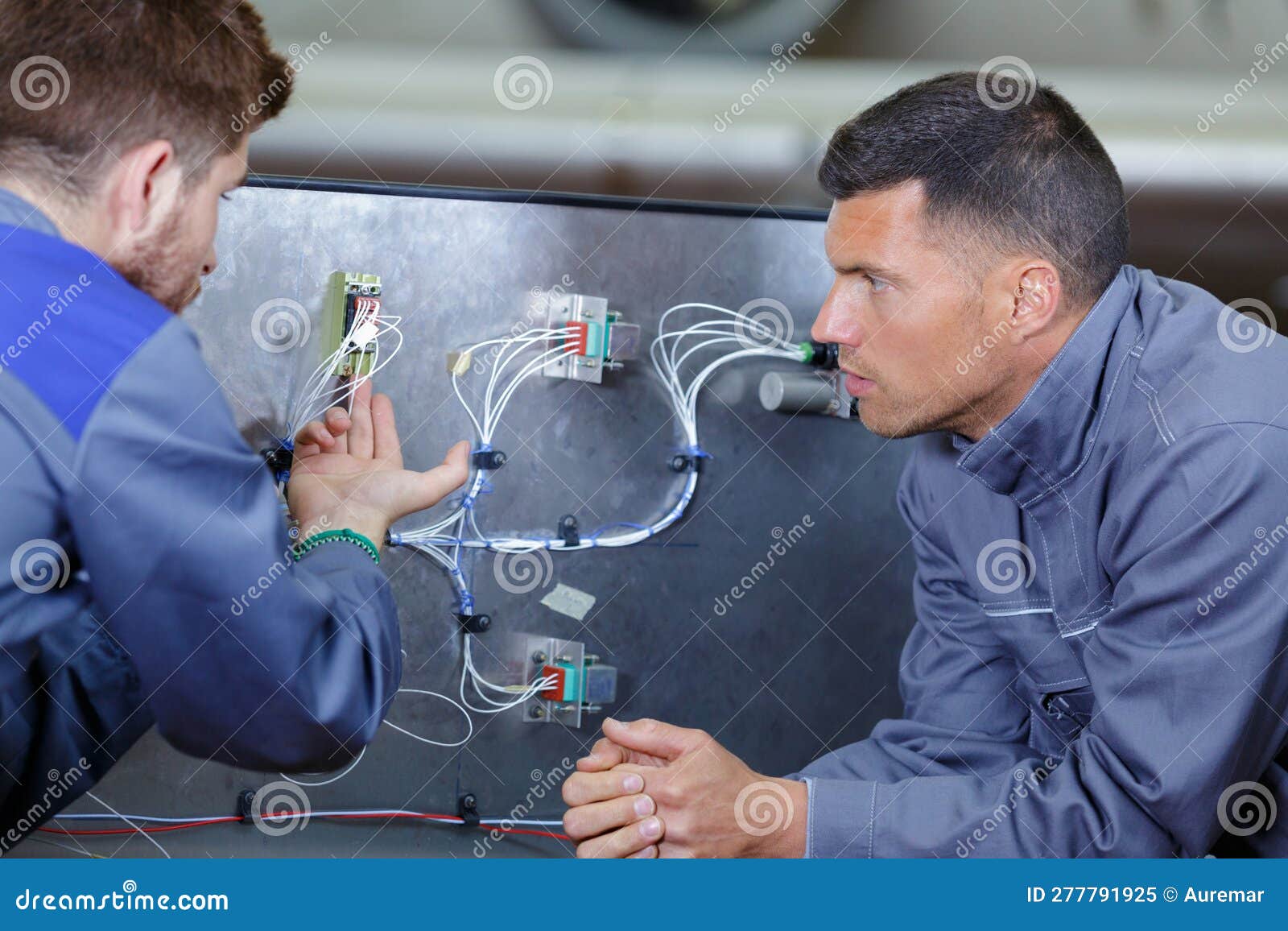 Young Electrician Fixing Electrical Problems on Pmachine Stock Image ...