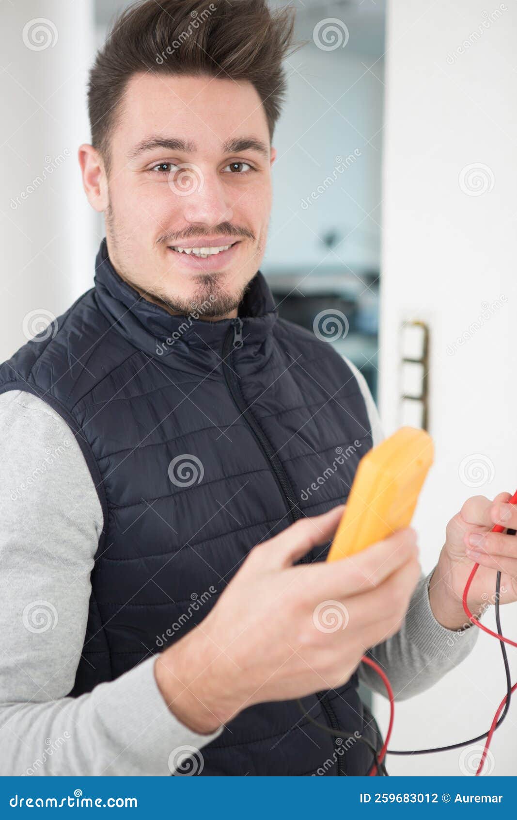 Young Electrician Holding Multimeter Stock Photo - Image of profession ...