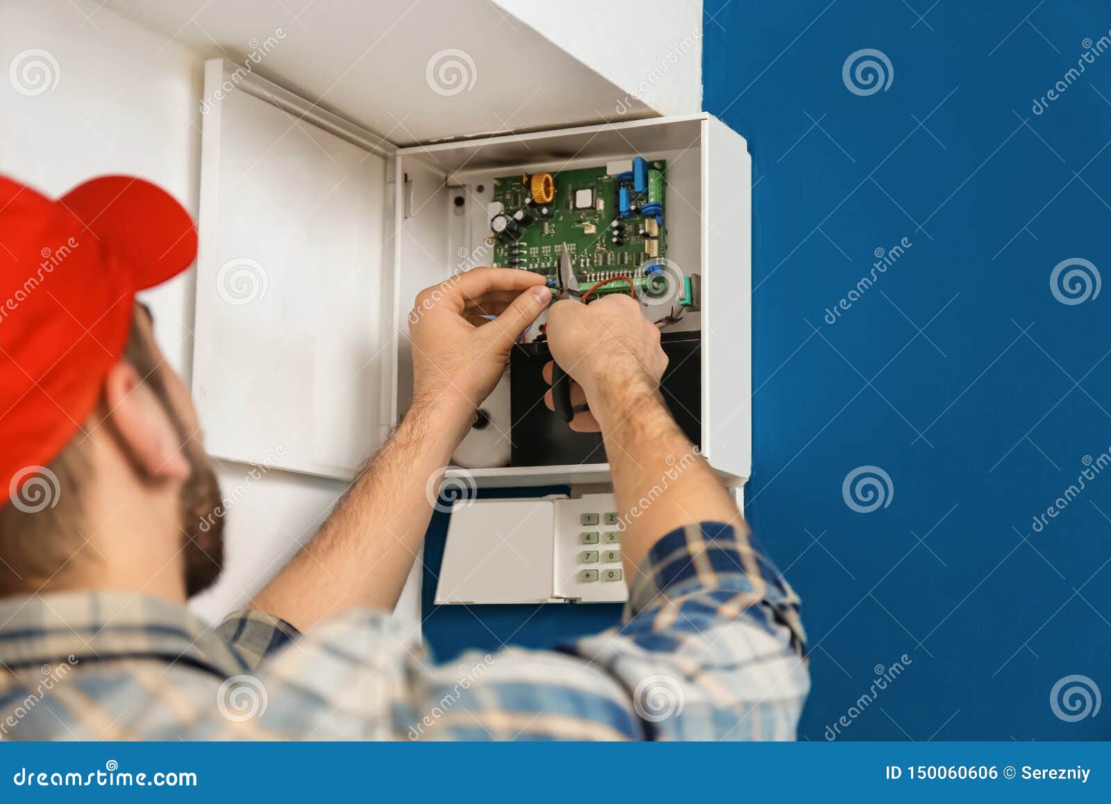 Young Electrician Installing Alarm System Stock Photo - Image of male ...