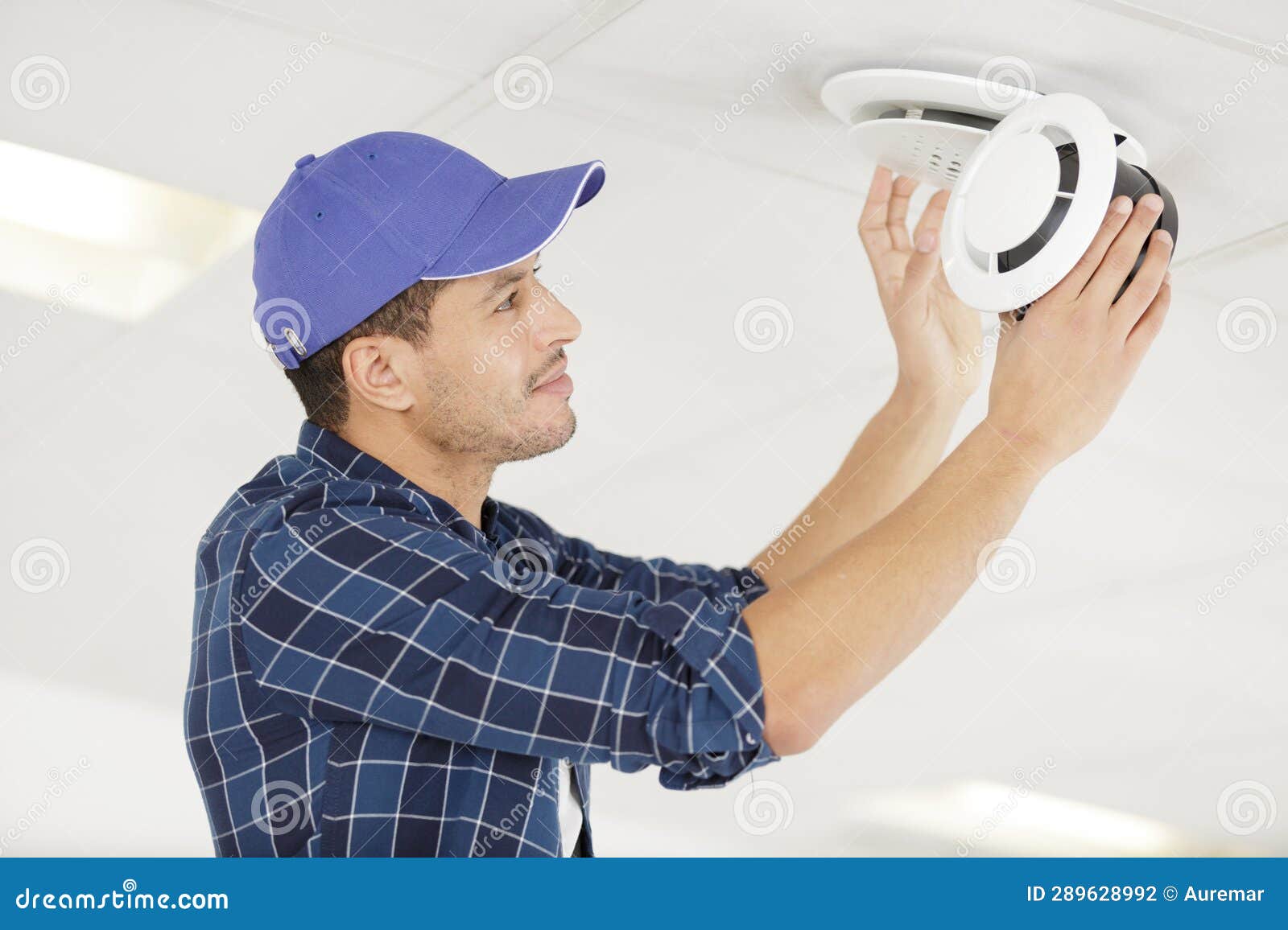 Young Electrician Installing Smoke Detector on Ceiling Stock Photo ... Young Electrician Installing Smoke Detector on Ceiling Stock Photo ...