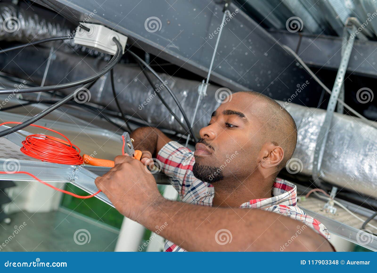 Young electrician at work stock photo. Image of junction - 117903348