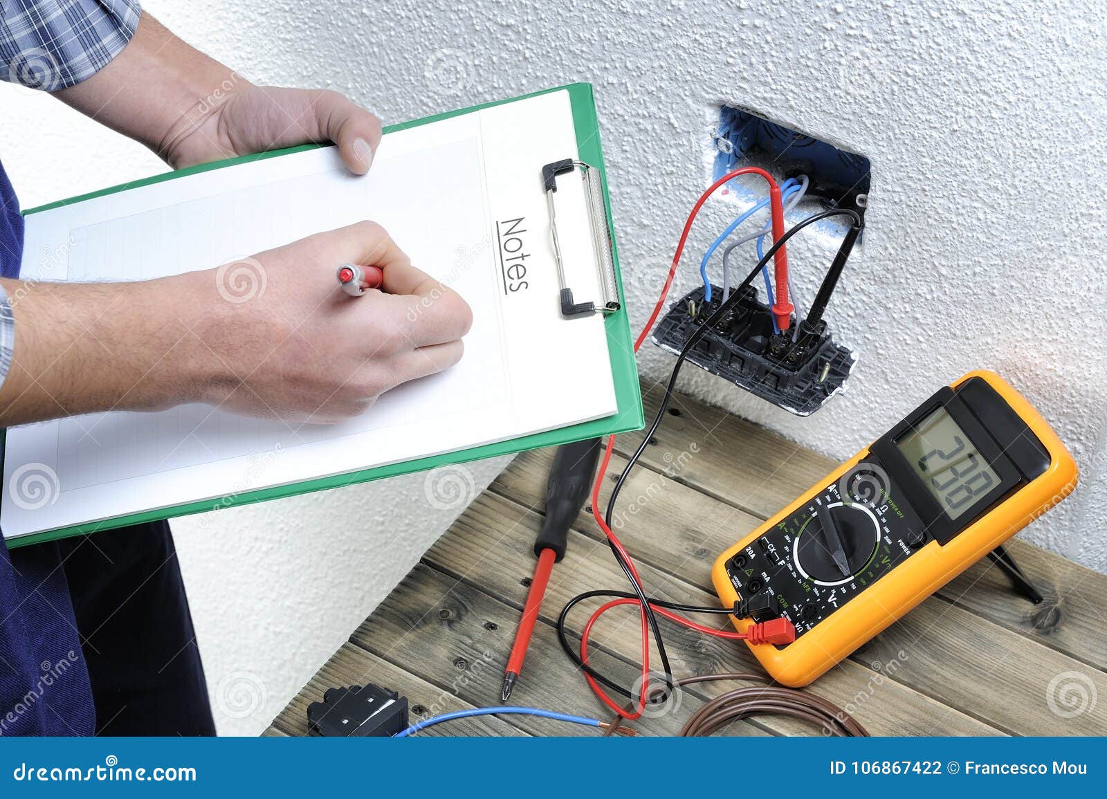 Young Electrician Working in a Residential Electrical Installation ...