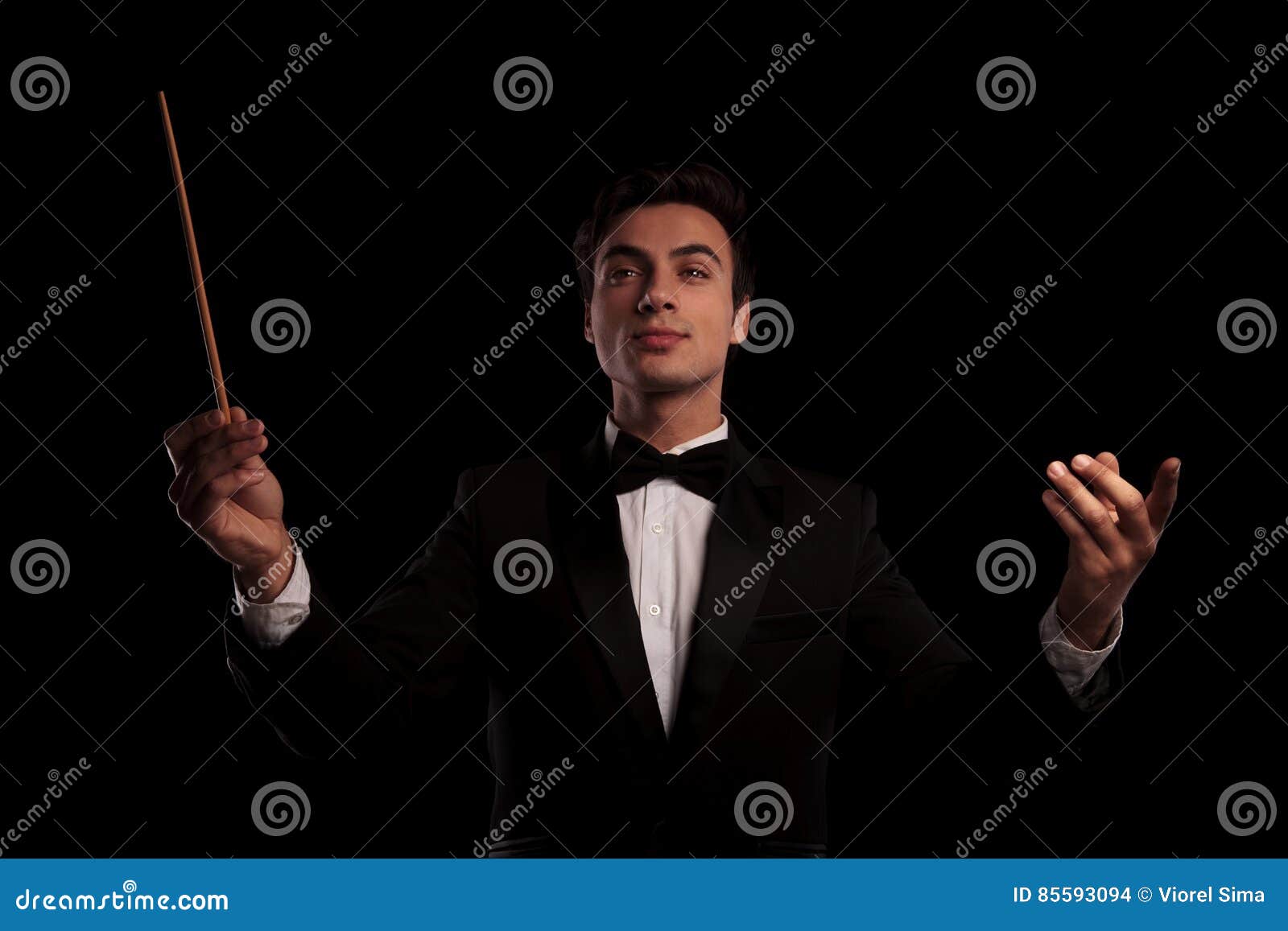 Confident Orchestra Conductor Directing With His Baton Royalty-Free ...