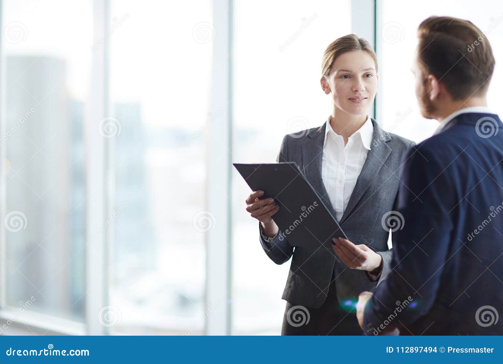 Agent with client stock photo. Image of document, attention - 112897494