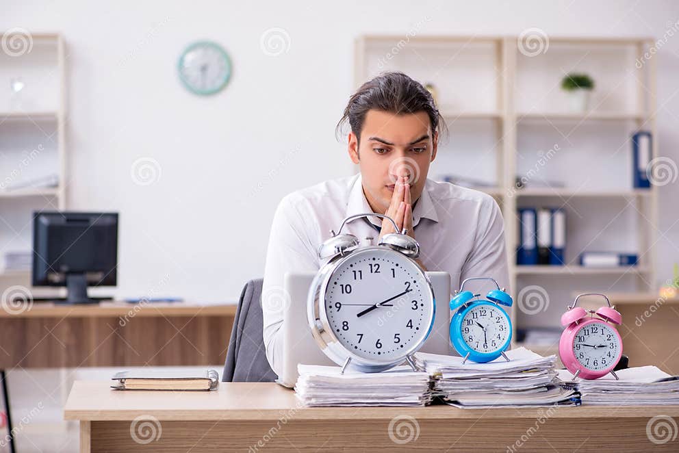 Young Male Employee Afraid of Missing Deadline at Workplace Stock Photo ...